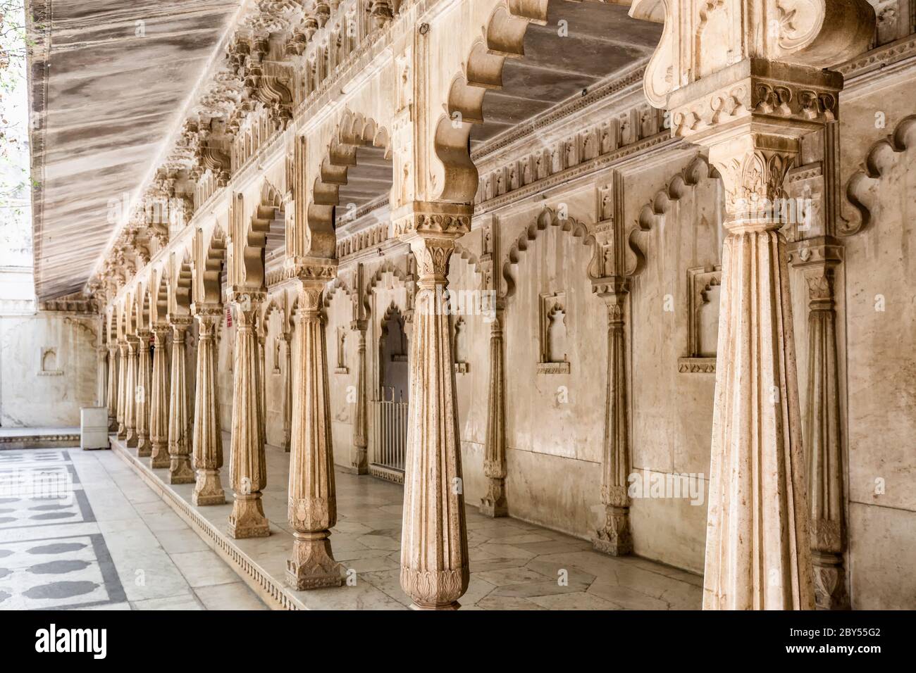 Udaipur castle courtyard with row of columns, India Stock Photo - Alamy