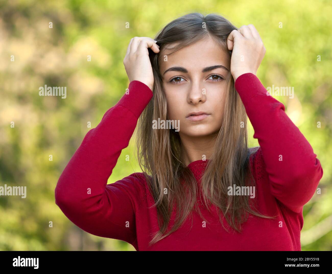 beautiful girl in a red jacket Stock Photo - Alamy