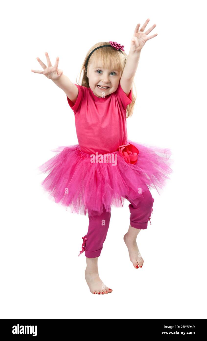 little girl in a pink dress dancing in studio Stock Photo - Alamy