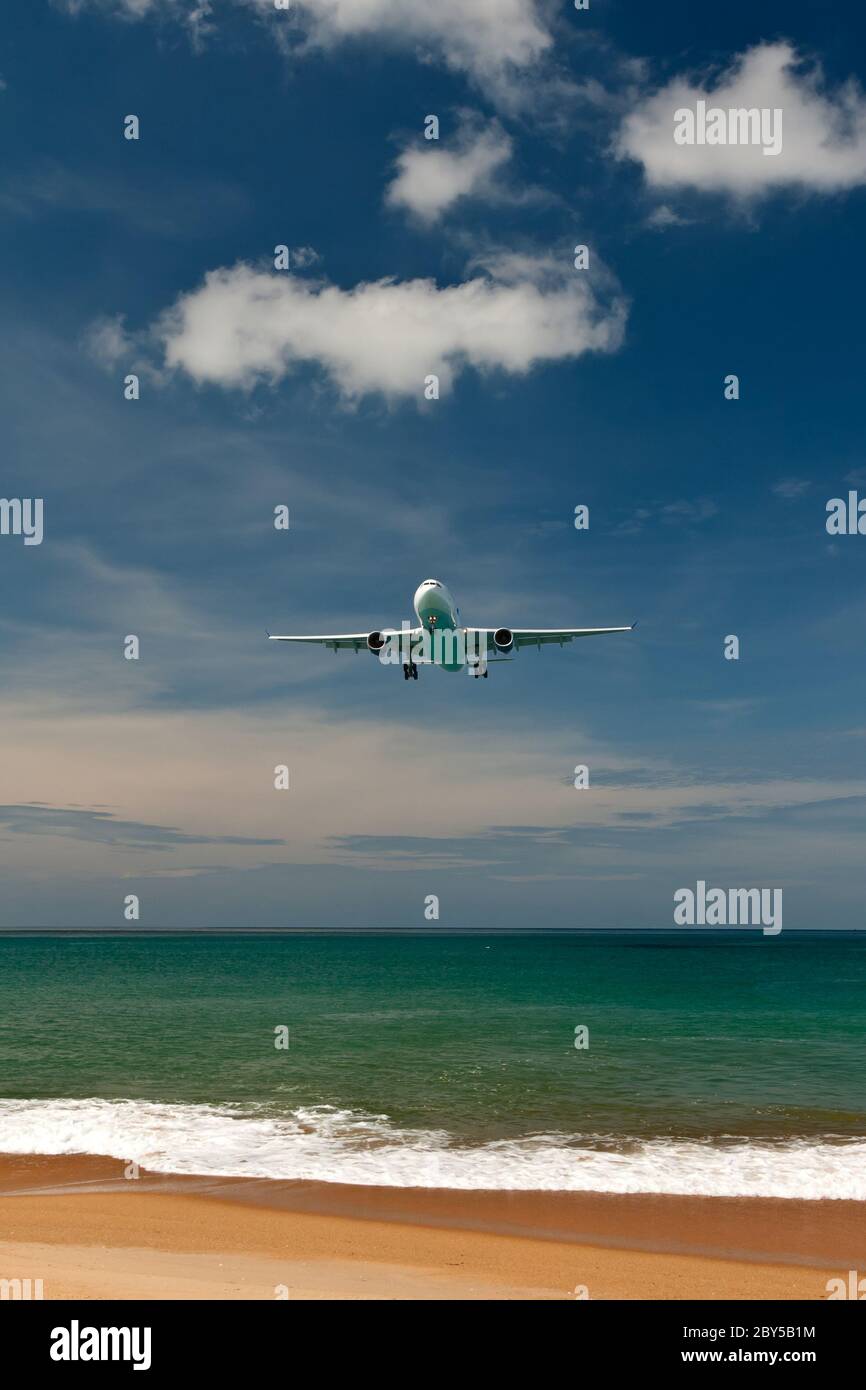 plane over a tropical beach Stock Photo - Alamy
