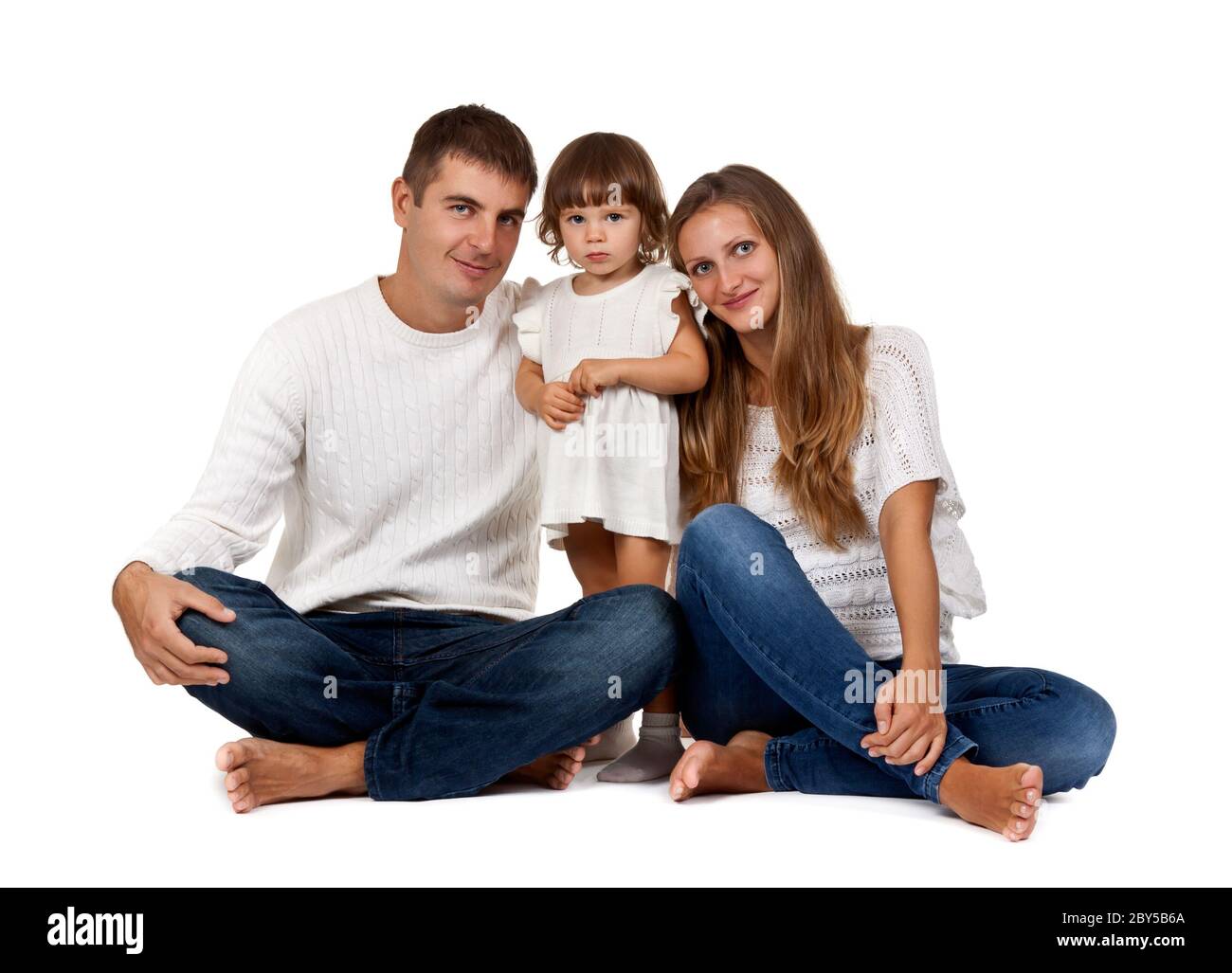 happy family sitting in the studio Stock Photo - Alamy