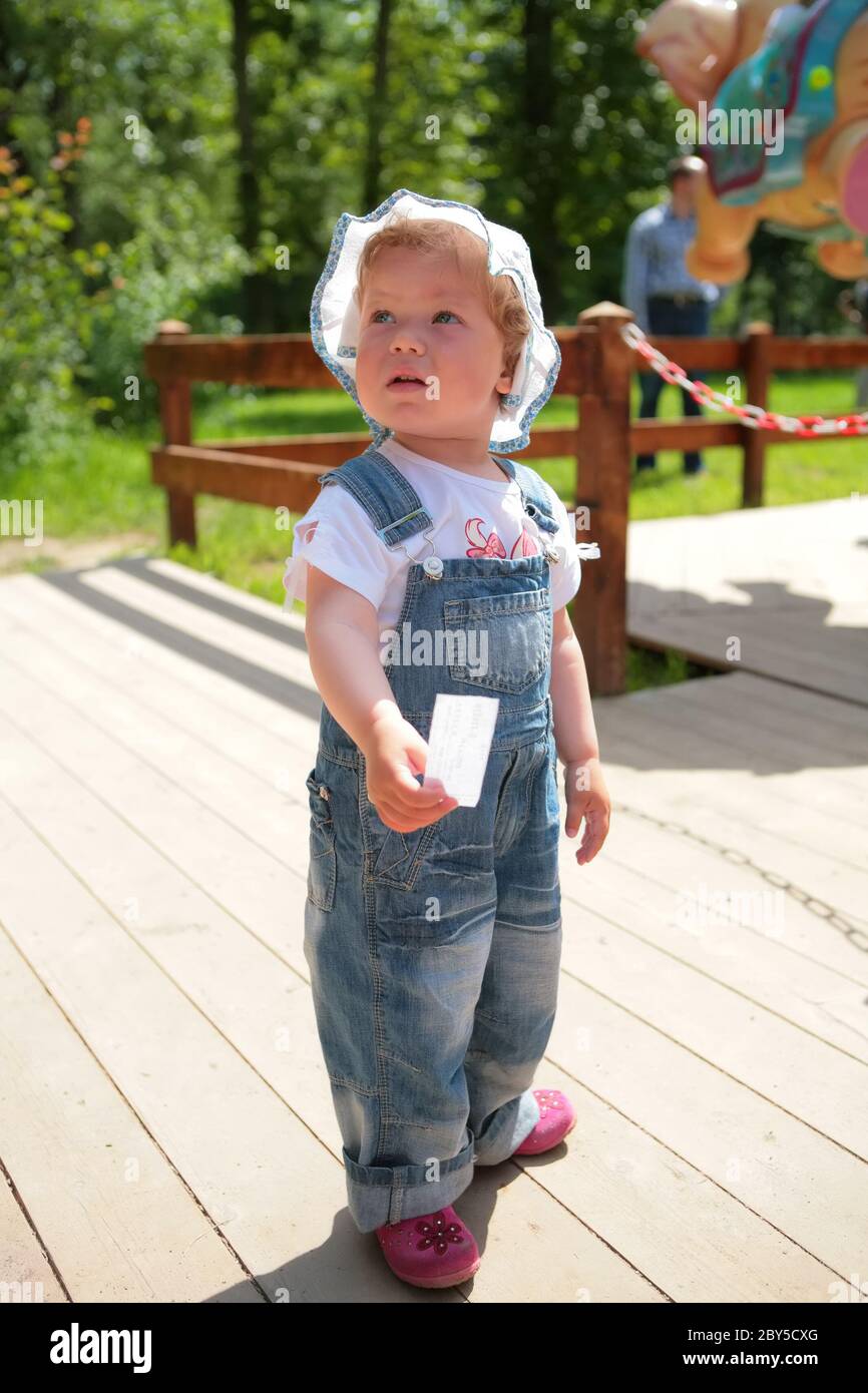 small girl with ticket in hand Stock Photo - Alamy