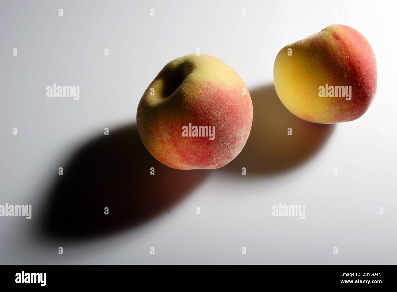 Two juicy ripe peaches hi-res stock photography and images - Alamy