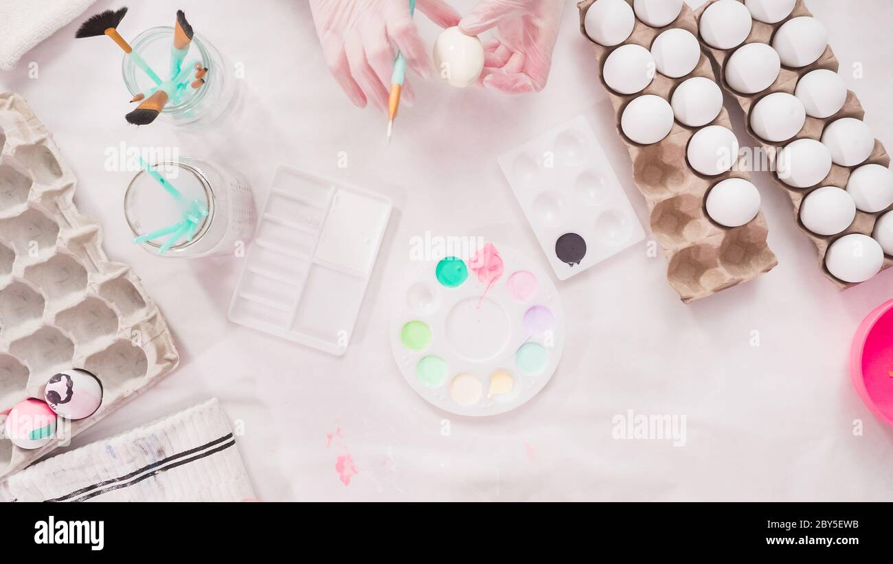Flat lay. Painting craft Easter eggs with acrilic paint Stock Photo - Alamy