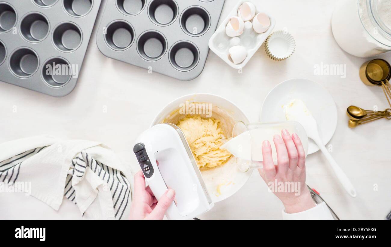 Flat lay. Step by step. Mixing batter to bake vanilla cupcakes with ...