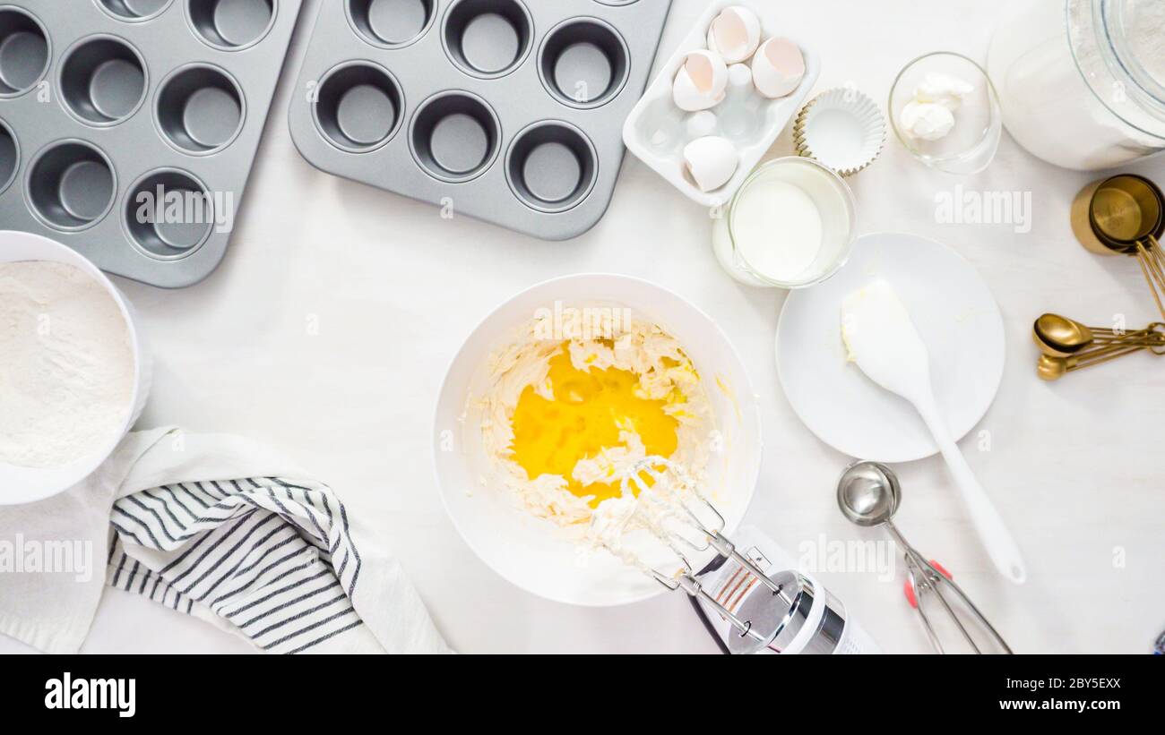 Flat lay. Step by step. Mixing batter to bake vanilla cupcakes with ...