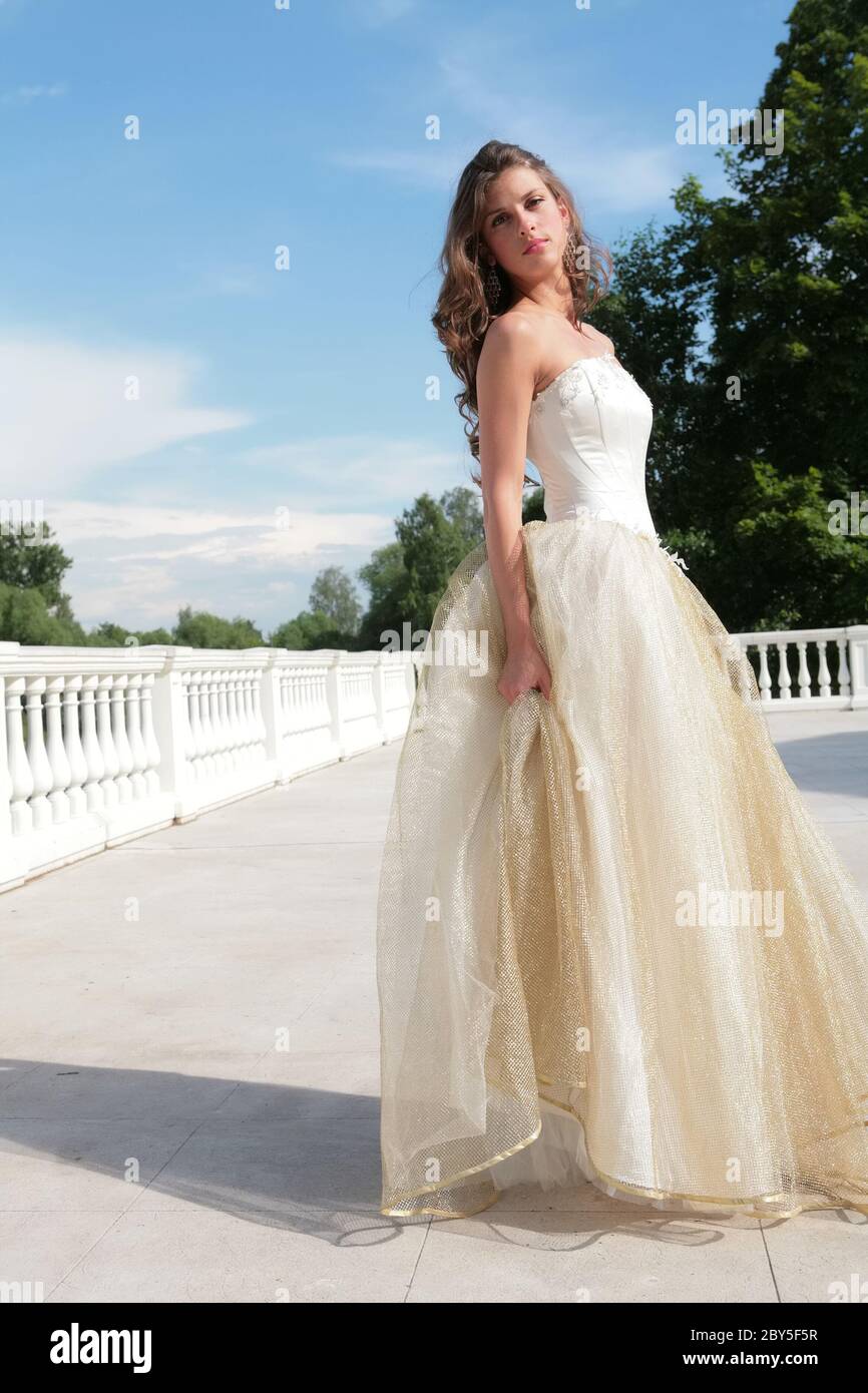 pretty princess in white-golden gown Stock Photo - Alamy