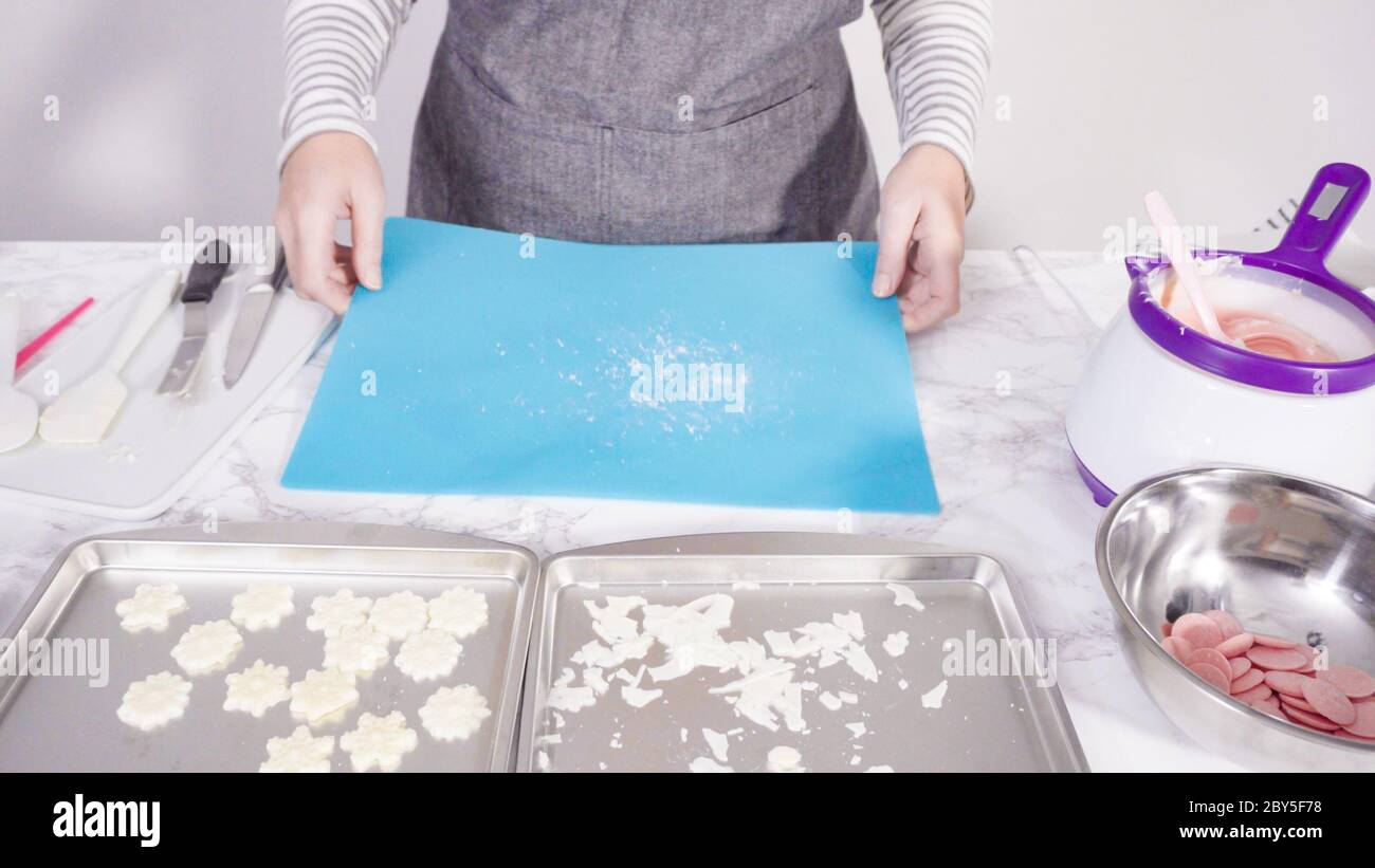 Step by step. Trimming excess chocolate with a small kitchen knife from ...