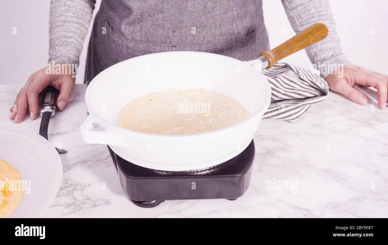 Making crepes in a small frying pan over medium heat Stock Photo - Alamy