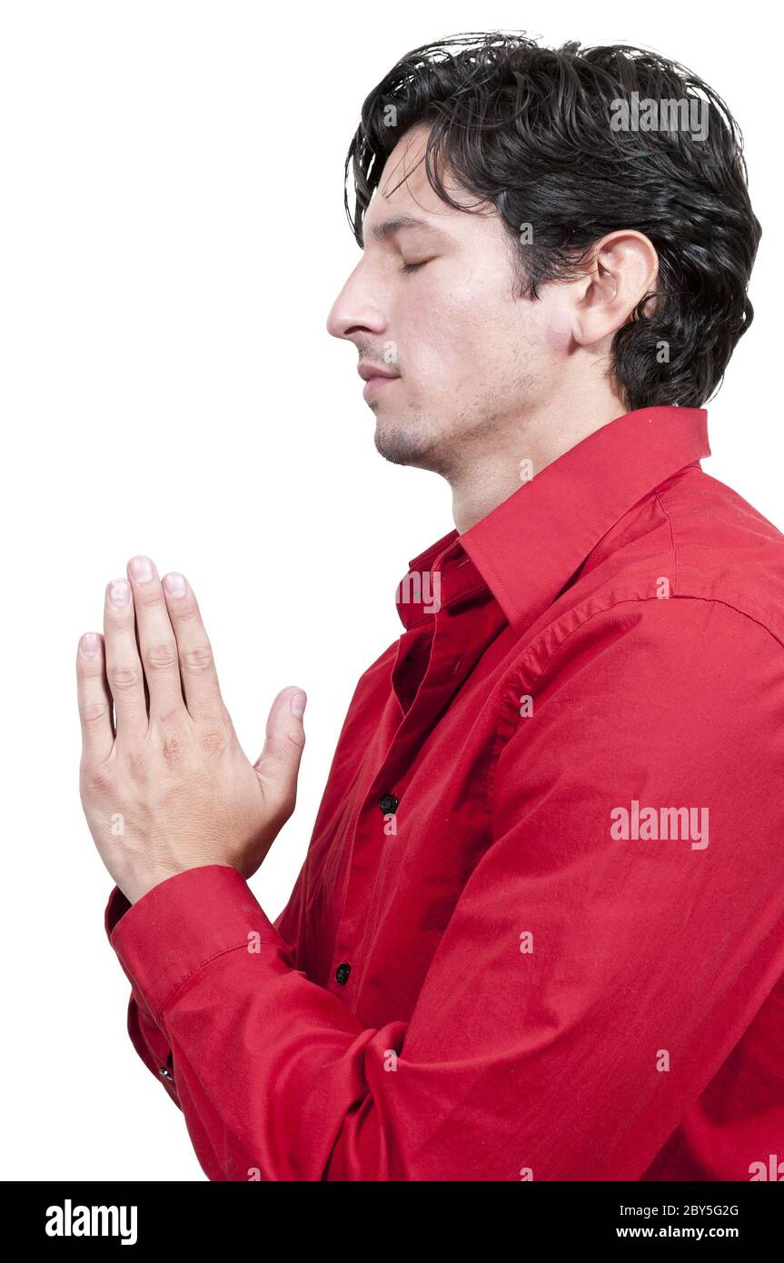 Man praying meditating kneeling hi-res stock photography and images - Alamy