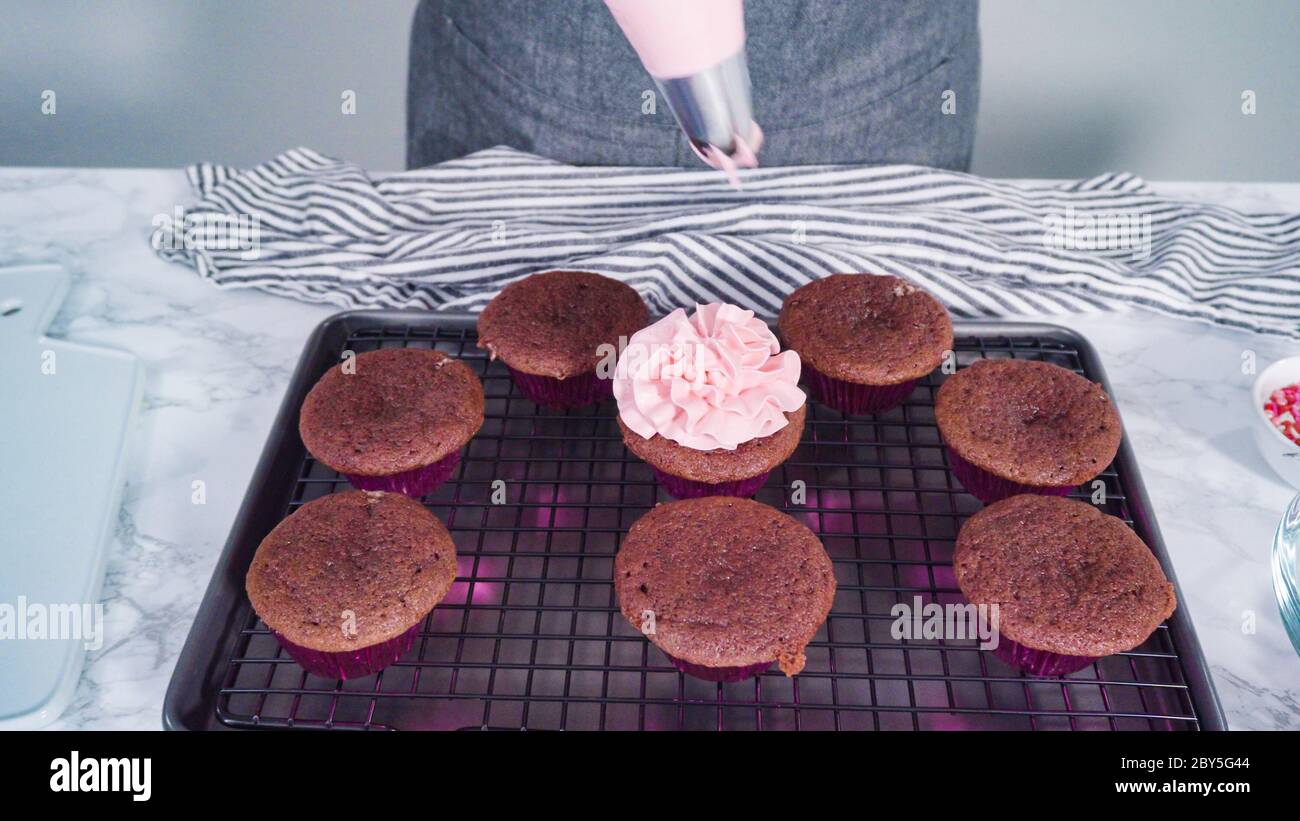 Step by step. Piping Italian buttercream frosting on top of red velvet ...