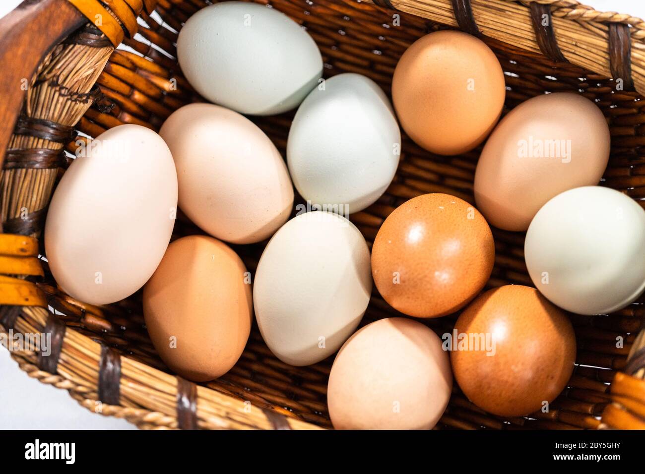 Farm fresh organic eggs in a small basket Stock Photo - Alamy