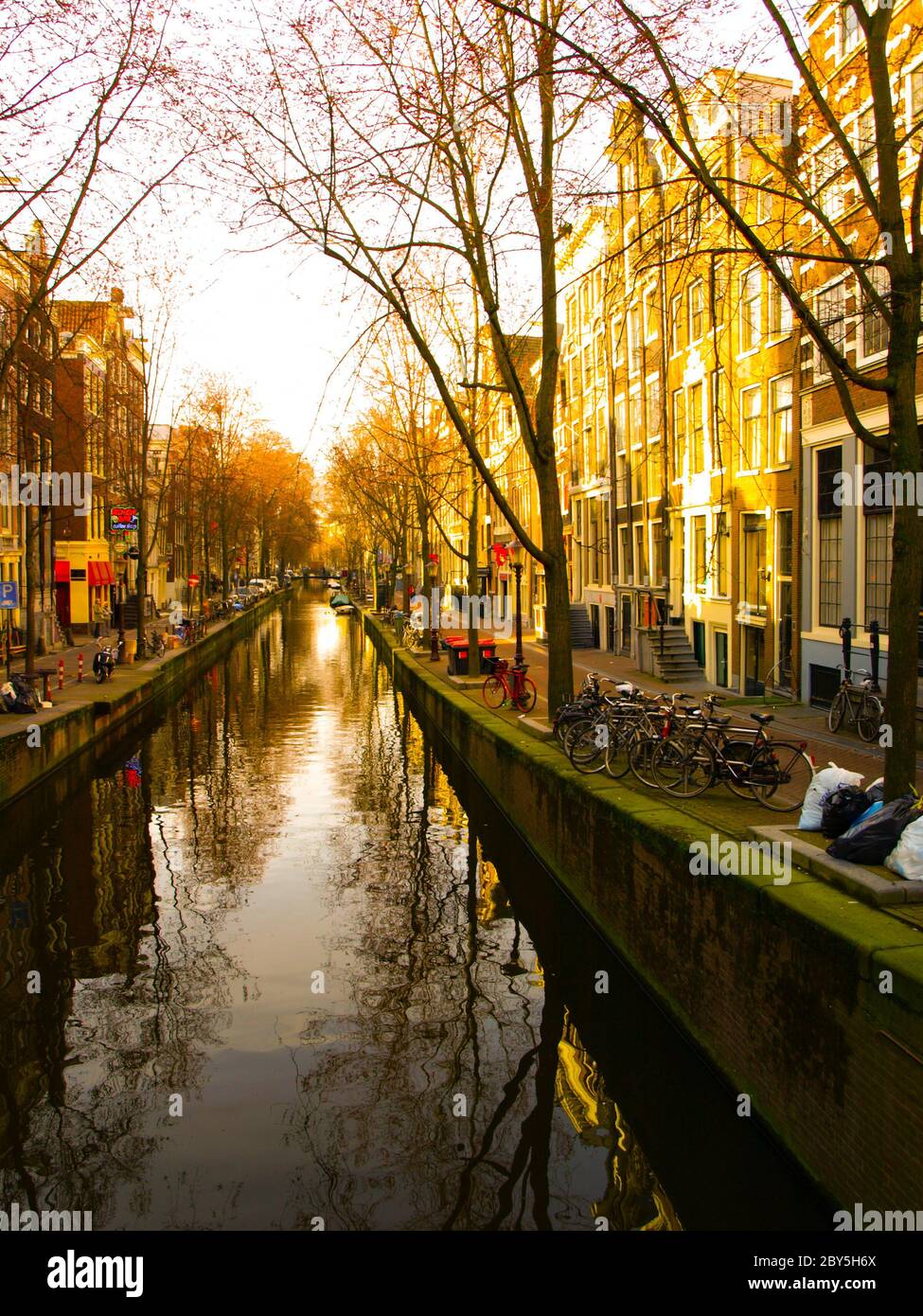 Typical water canal - gracht - and narrow houses along it in Amsterdam ...