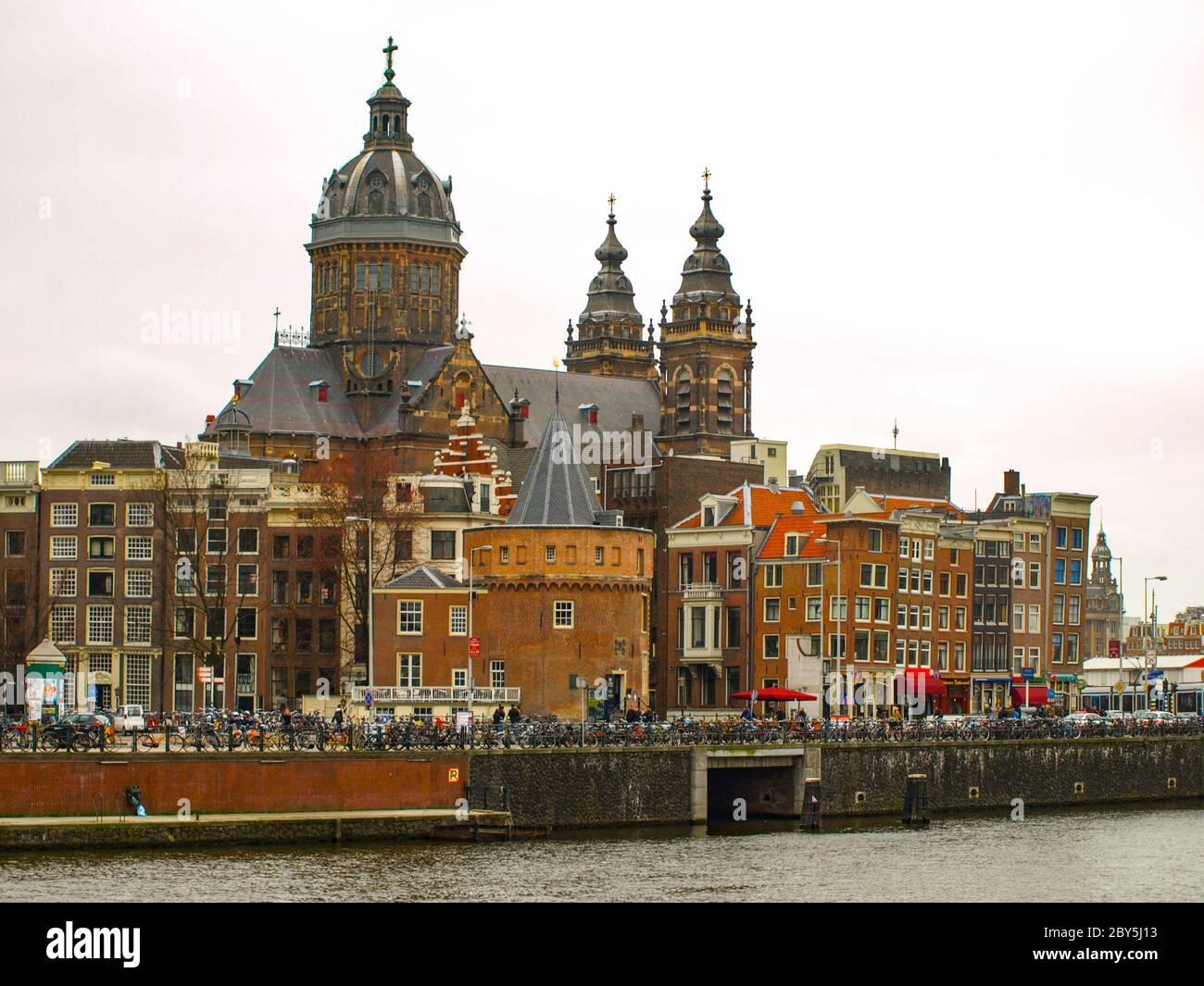 View of Basilica of Saint Nicholas from harbor, Amsterdam, Netherlands ...