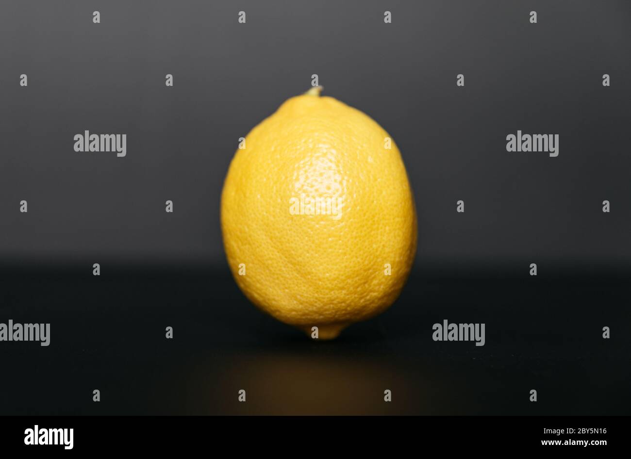 Close up of Fresh Lemon on a dark grey background Stock Photo - Alamy
