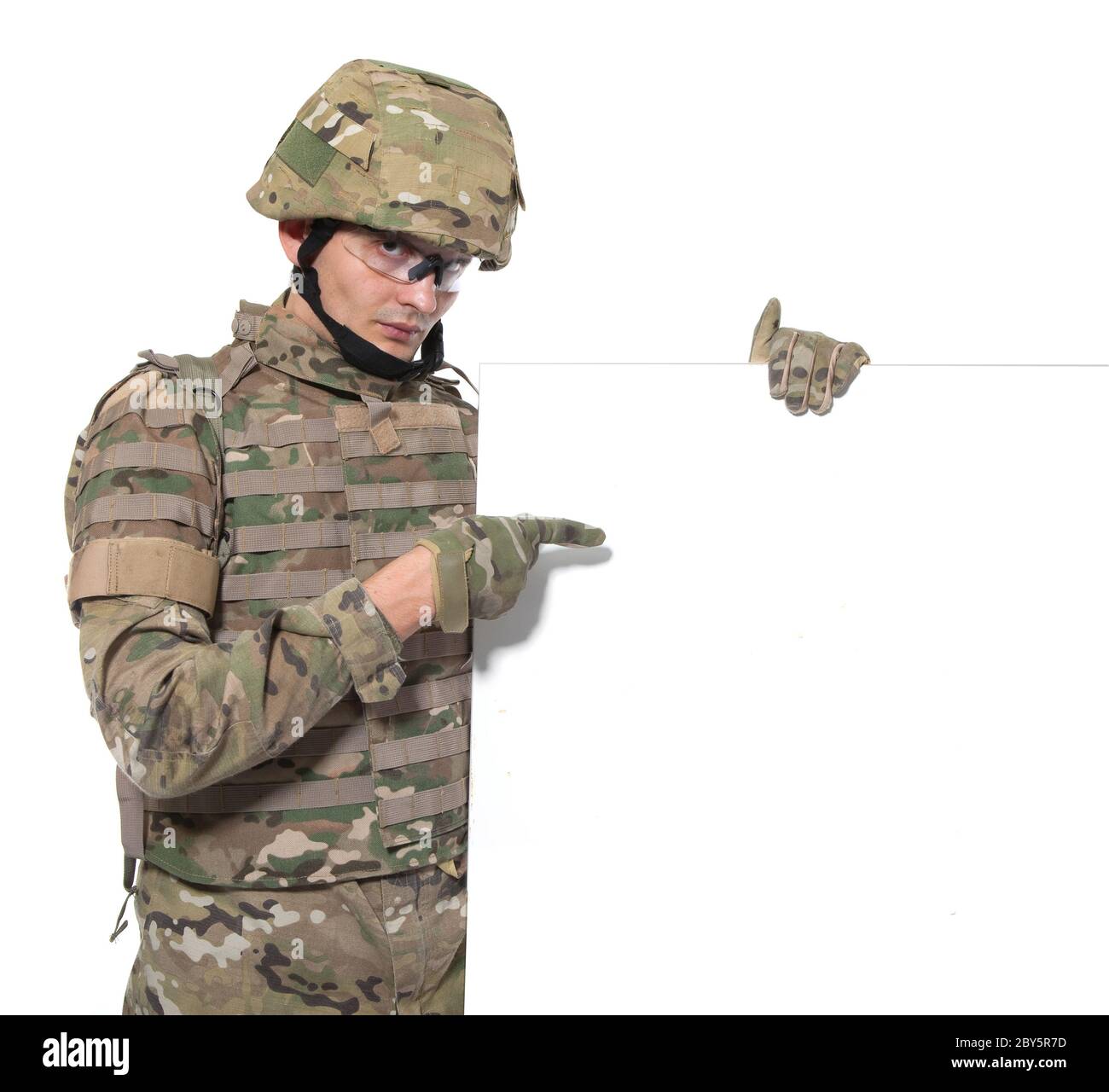 Modern soldier holding a poster Stock Photo - Alamy
