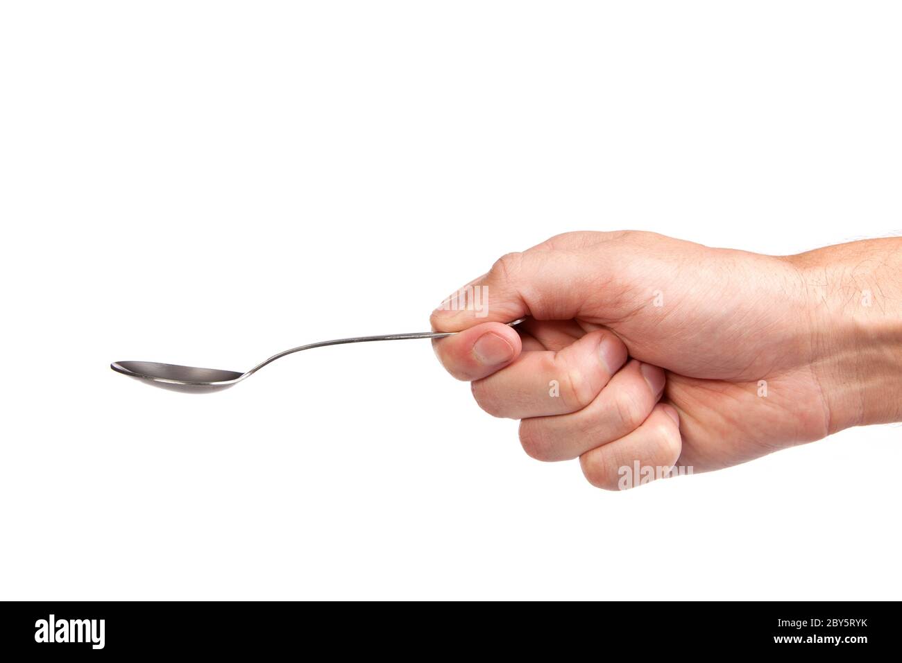 Hand is holding a spoon isolated Stock Photo - Alamy