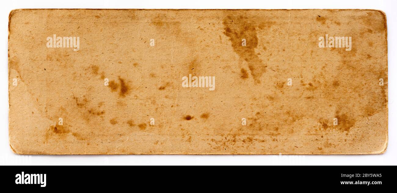 Old yellow craft paper card isolated Stock Photo - Alamy
