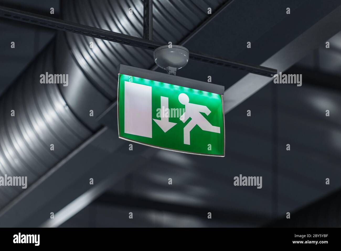 Emergency exit sign with stainless steel ventilation pipes in ...