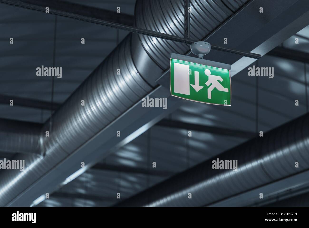 Emergency exit sign with stainless steel ventilation pipes in ...