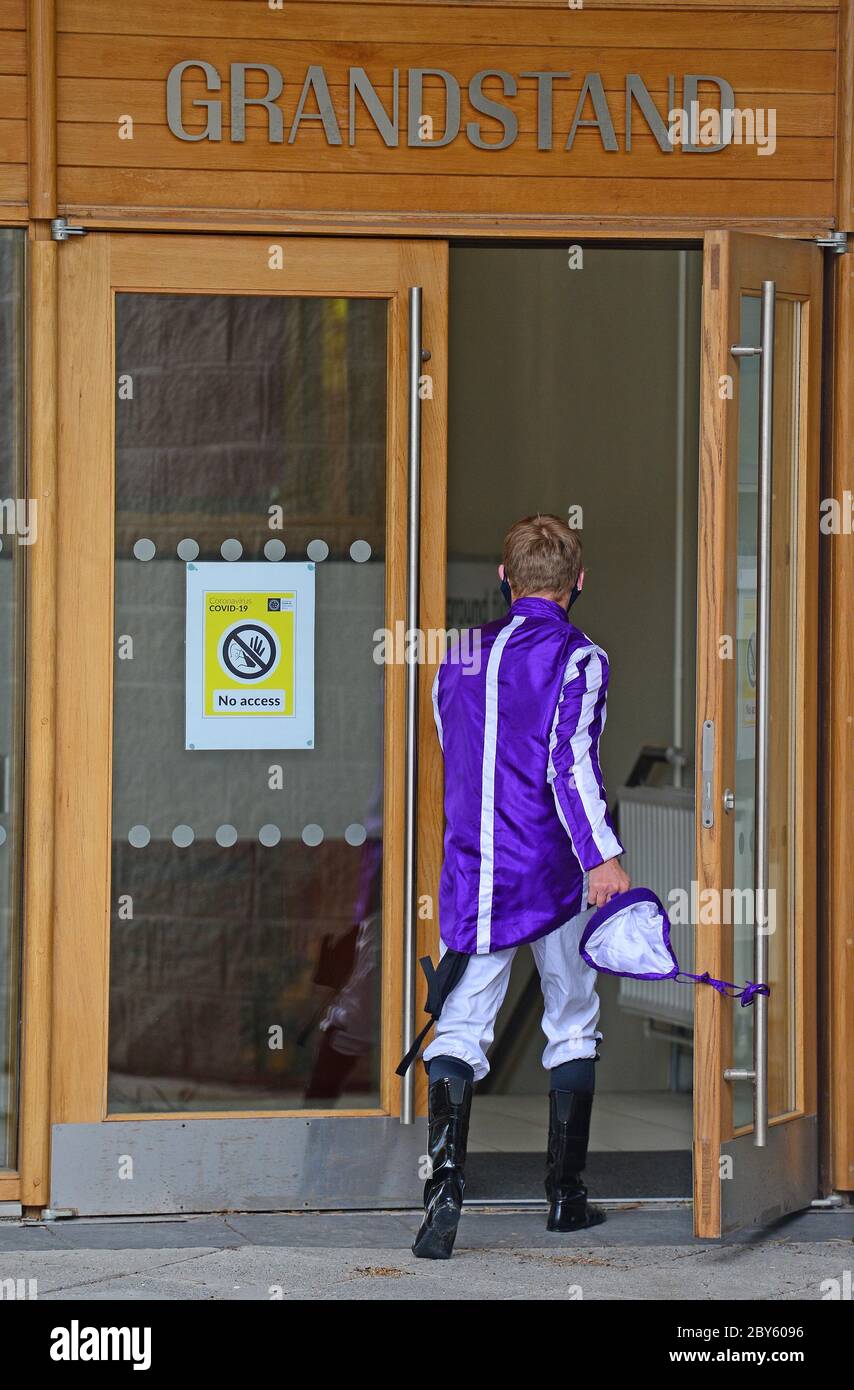 Jockey Mick Hussey opens the door to the temporary jockeys room at ...