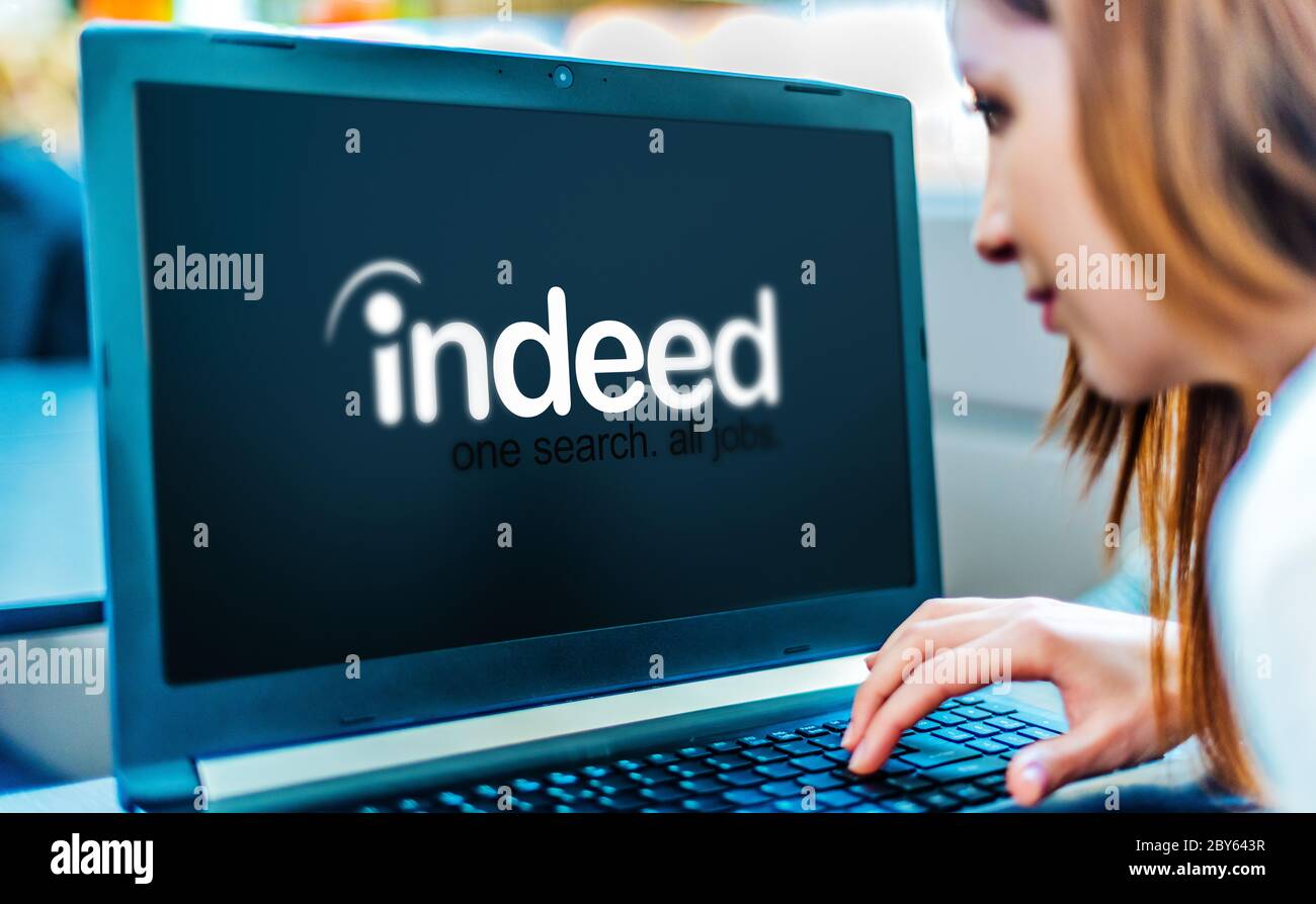 POZNAN, POL - FEB 7, 2020: Young woman at the laptop computer ...