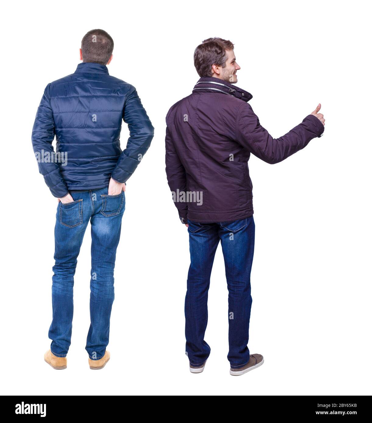Back view of two man in winter jacket showing thumb up. Rear view ...