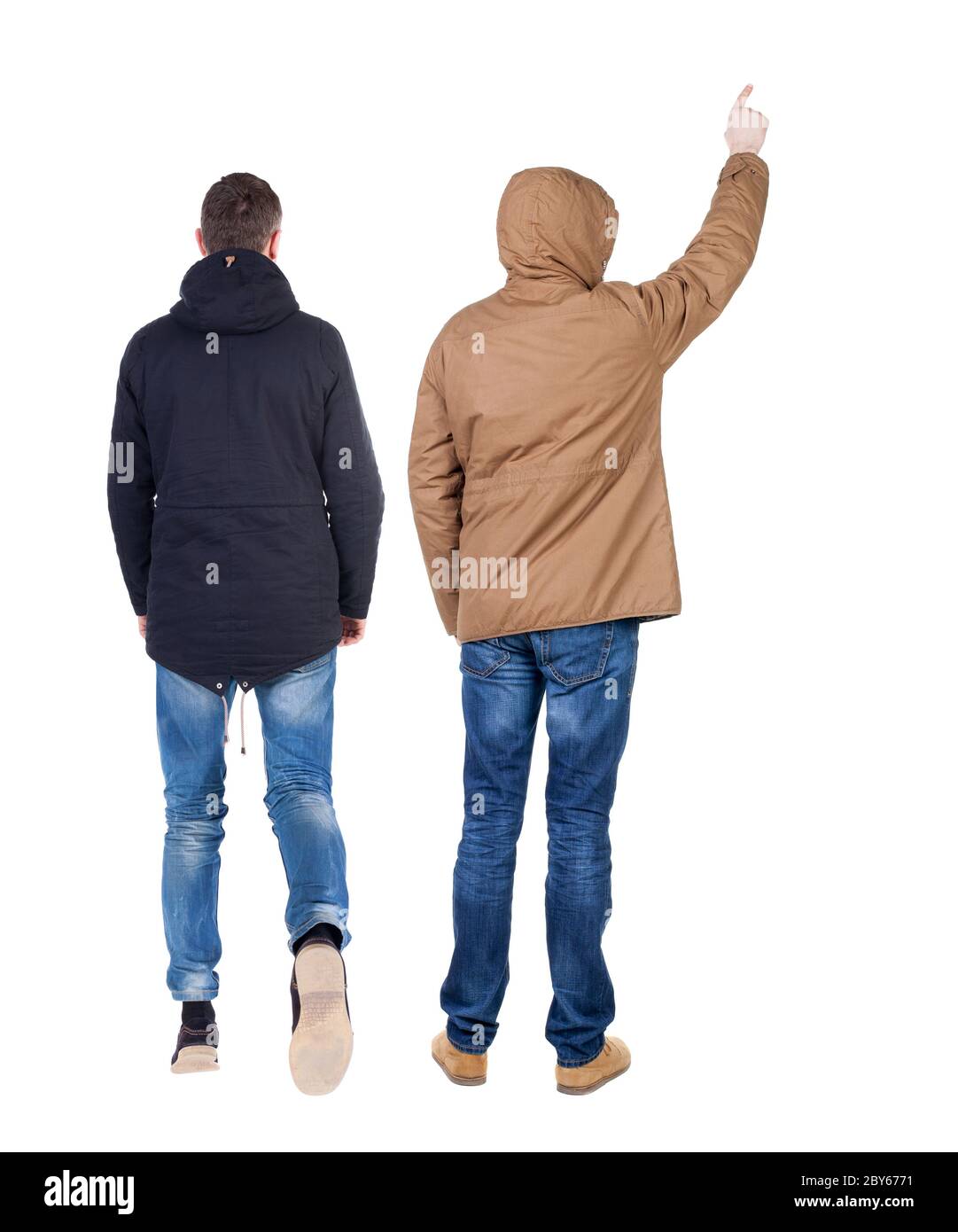 Back view of couple couple in winter jackets pointing. beautiful ...