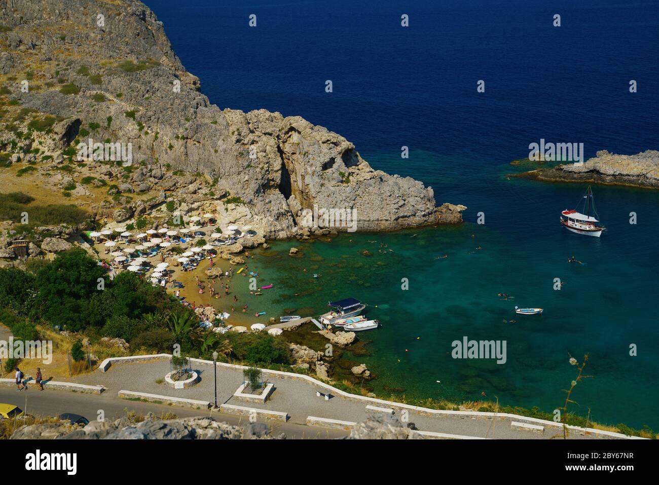 Rhodes, Greece - July 2019: Agios Pavlos Beach. Overlooking the stunning St Pauls Bay Lindos ...