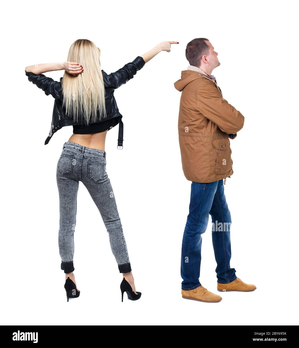Back view of two pointing girl in winter jacket. Rear view people ...