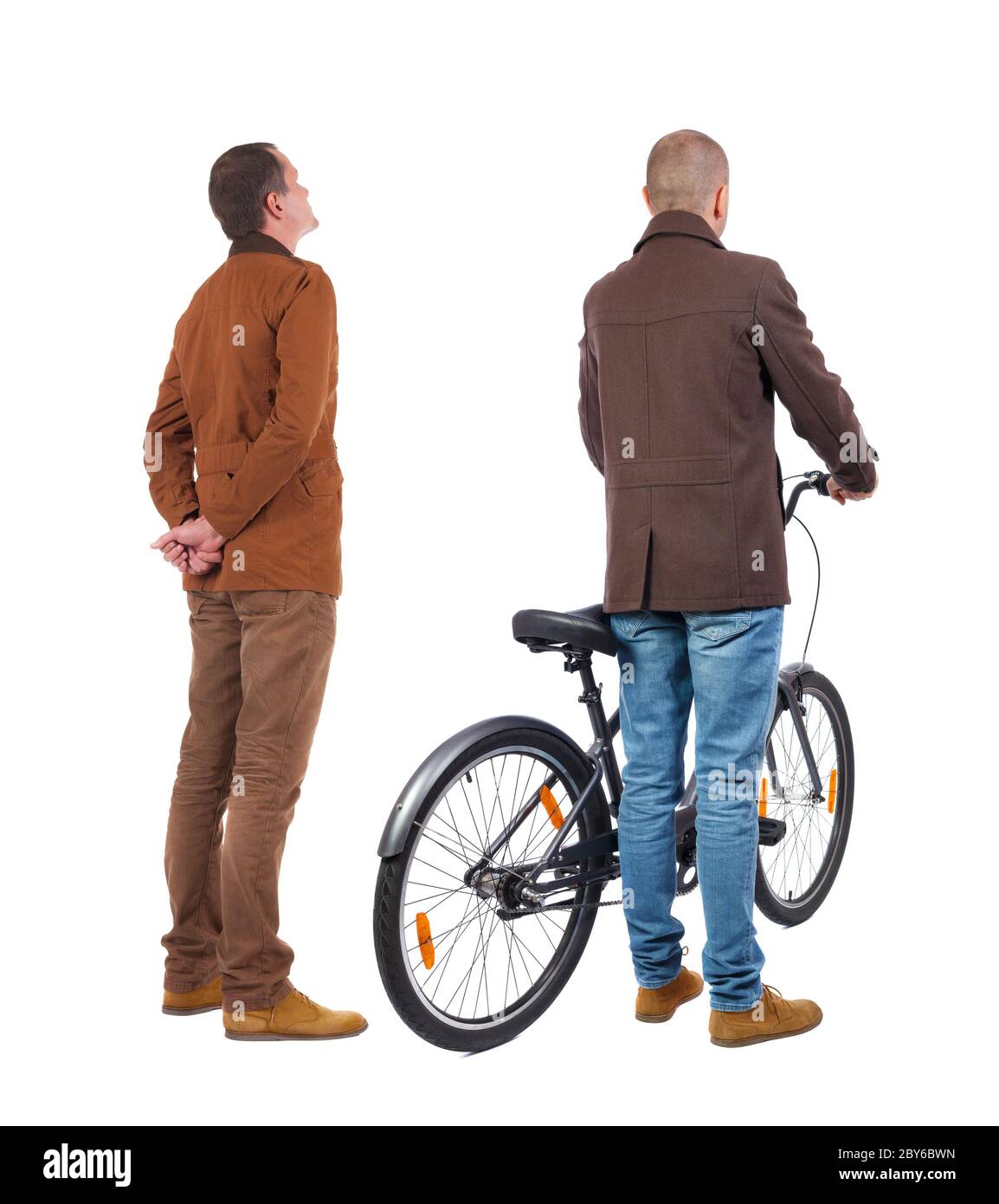 Back view of two man on a bicycle in winter jacket. Rear view people ...