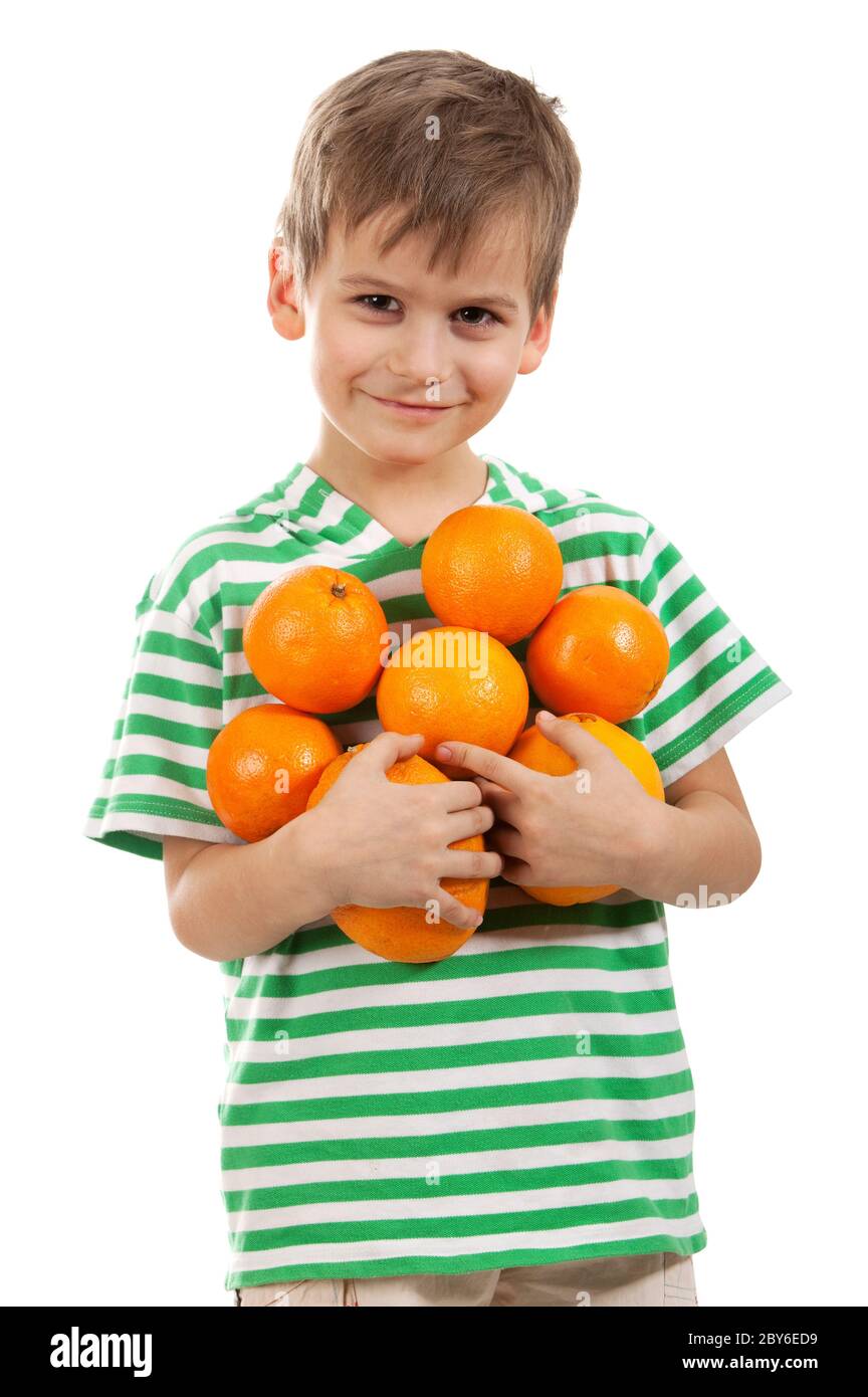Boy holding oranges Stock Photo - Alamy