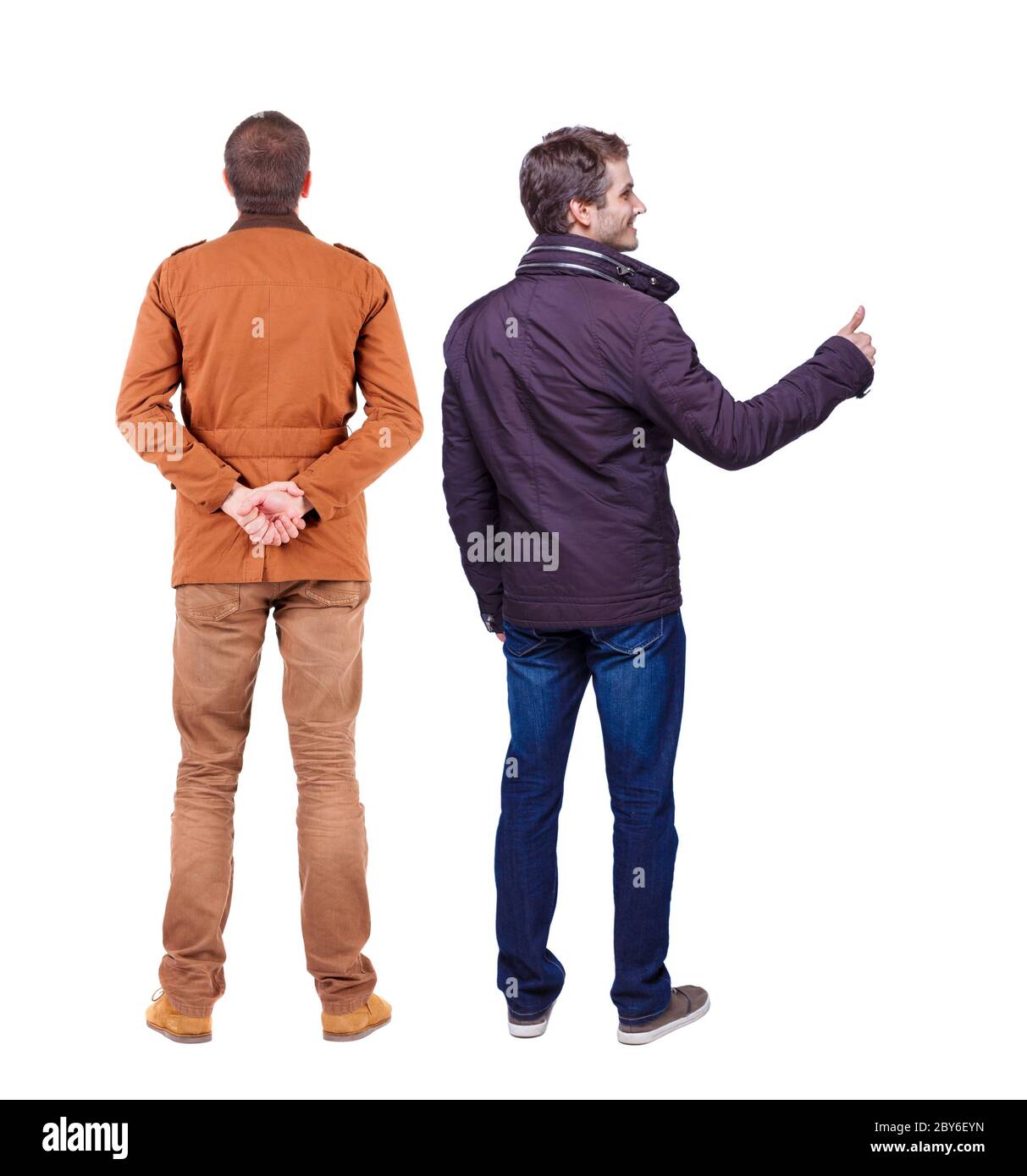 Back view of two man in winter jacket showing thumb up. Rear view ...