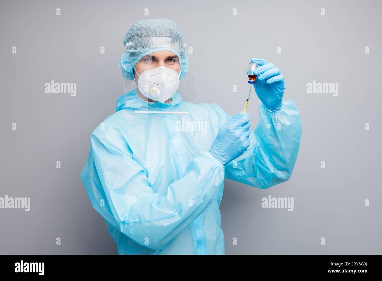 Photo of guy expert doc virologist prepare antibiotic bottle injection ...