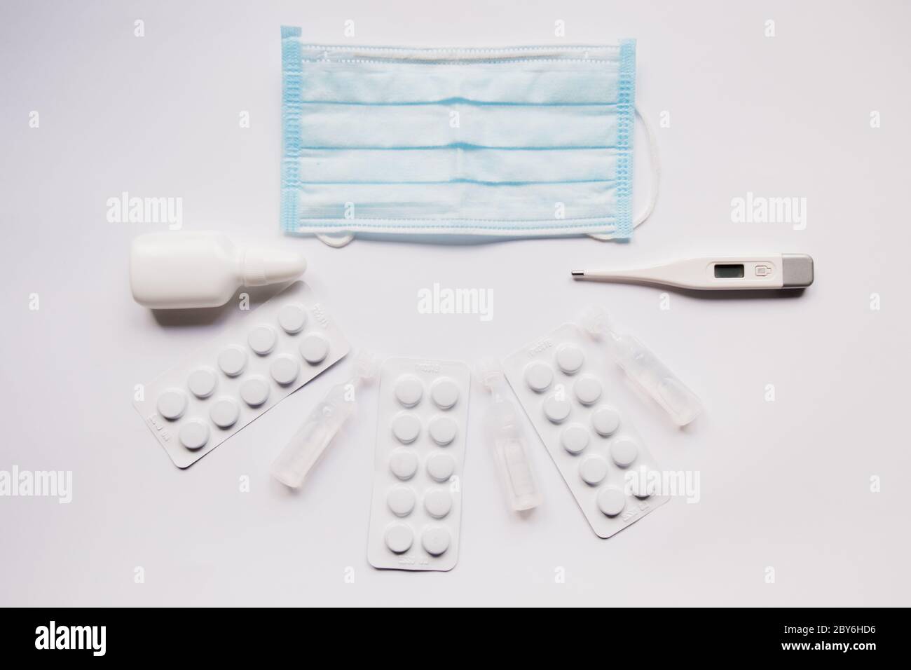 electronic thermometer with a medication and mask Stock Photo - Alamy