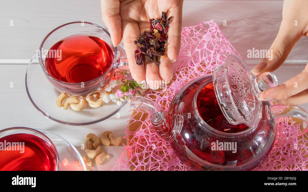 Woman makes herbal tea pouring hi-res stock photography and images - Alamy