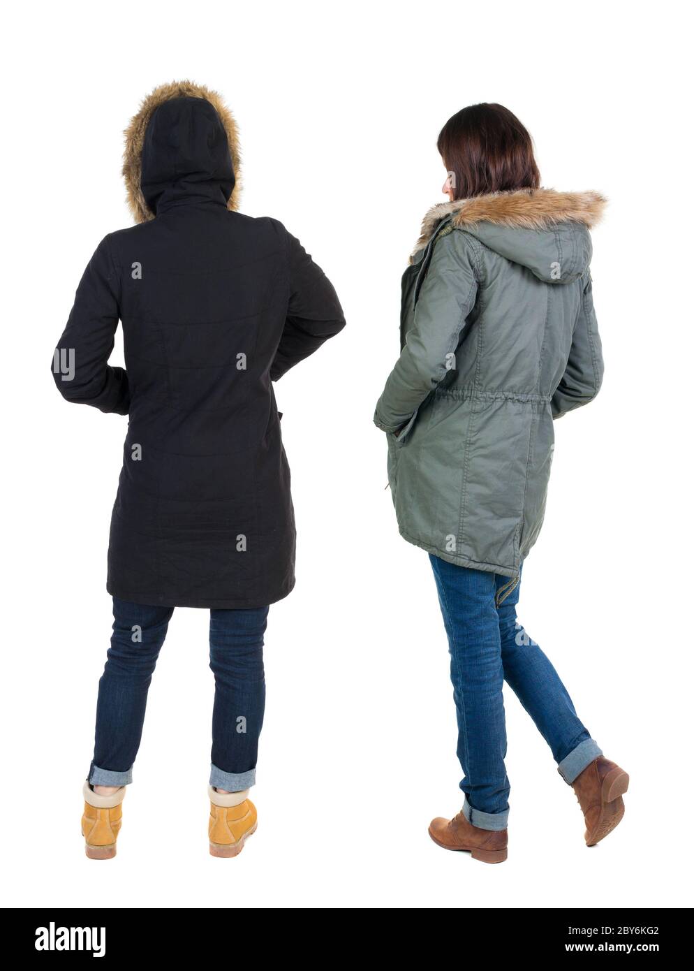 Back view of two young woman in winter jackets. Rear view people ...