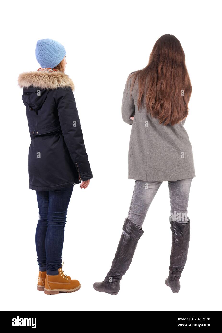 Back view of two young woman in winter jackets. Rear view people ...