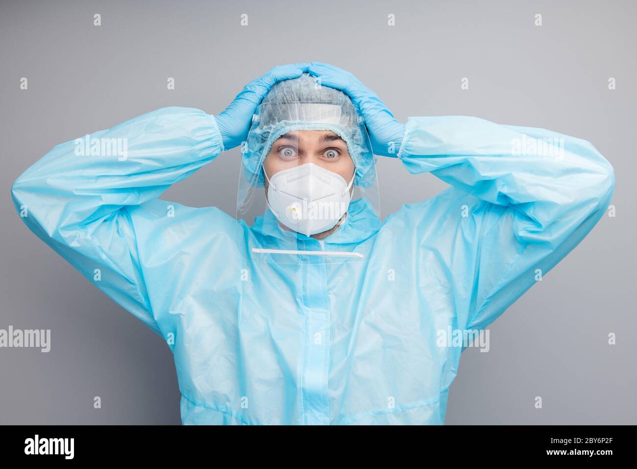 Photo of guy expert doc virology center big eyes full of fear hold arms ...