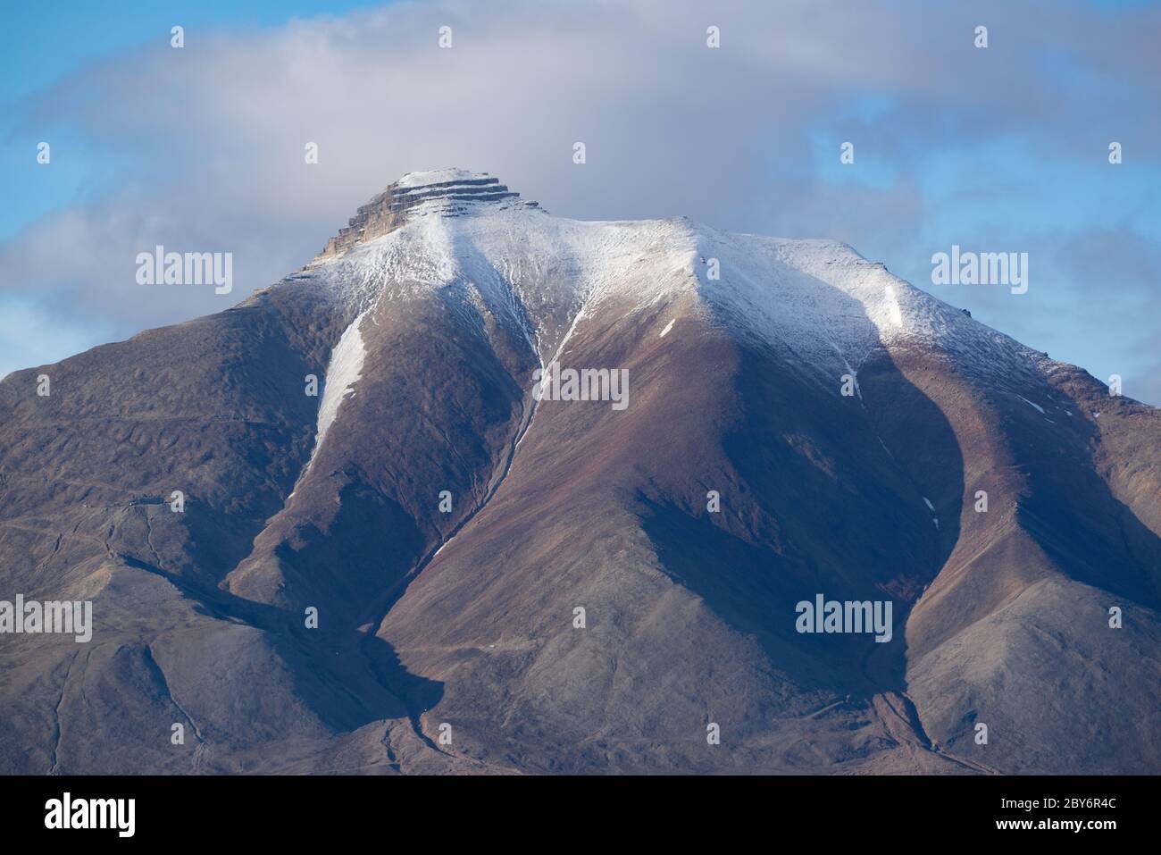 Mountain called "Pyramiden" close to a Russian ghost town with the same ...