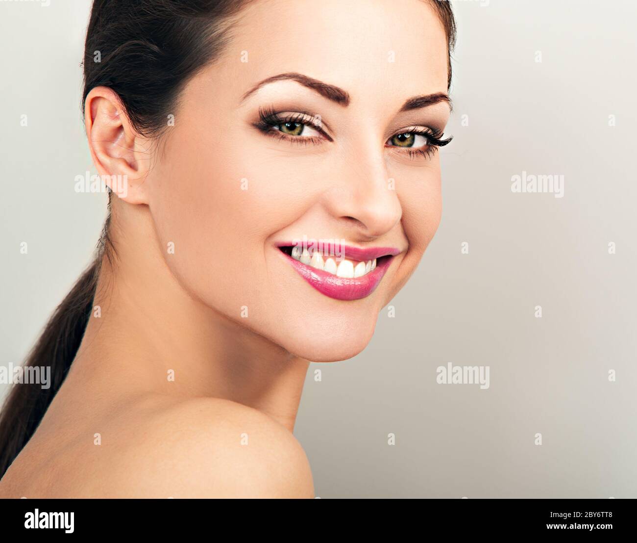 Beautiful woman with healthy clean face skin smiling with toothy smile ...