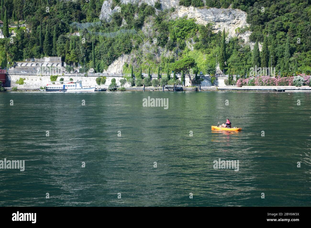 Fishing alone on Lake Garda, Italy Stock Photo - Alamy