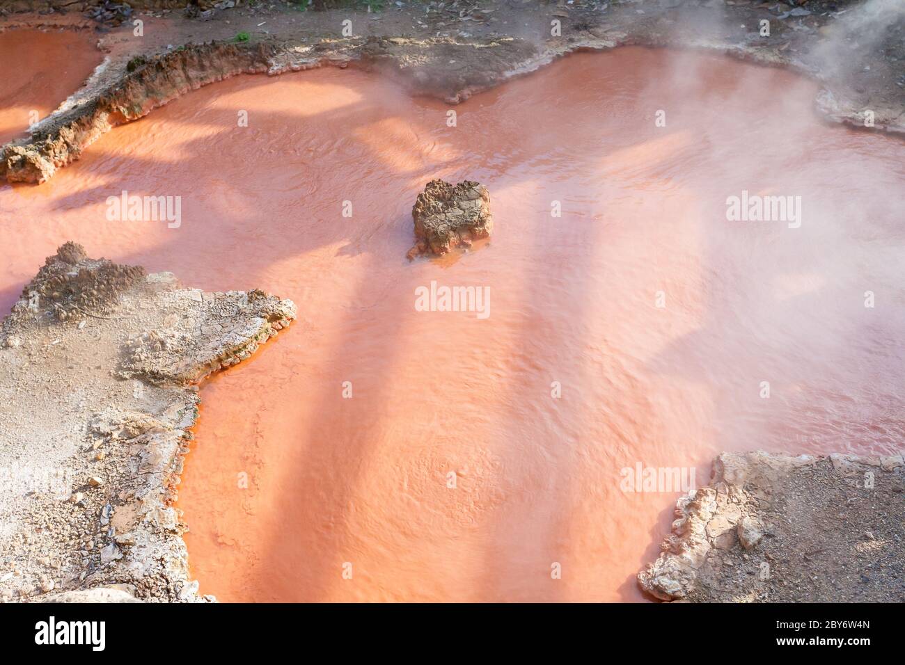 Multi-colored volcanic pool of boiling water in Kannawa district in ...
