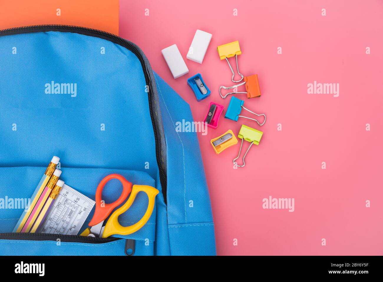 Blue bag backpack for education children on pink background back to ...