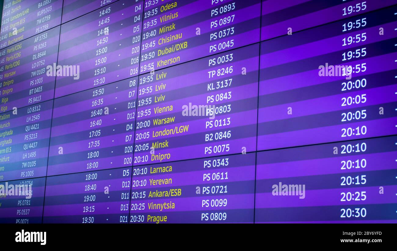 Digital board with schedule of airplane flights in airport Stock Photo ...