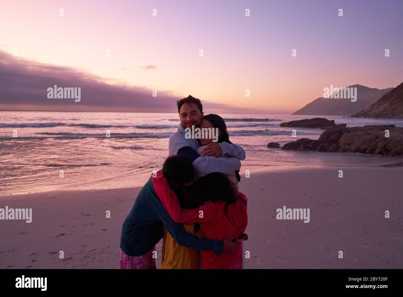 Family group hugging hi-res stock photography and images - Alamy