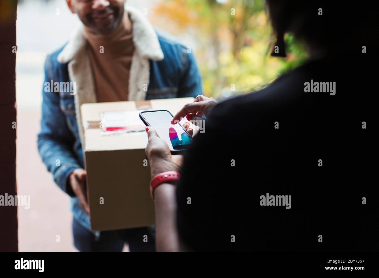 Signing for package hi-res stock photography and images - Alamy