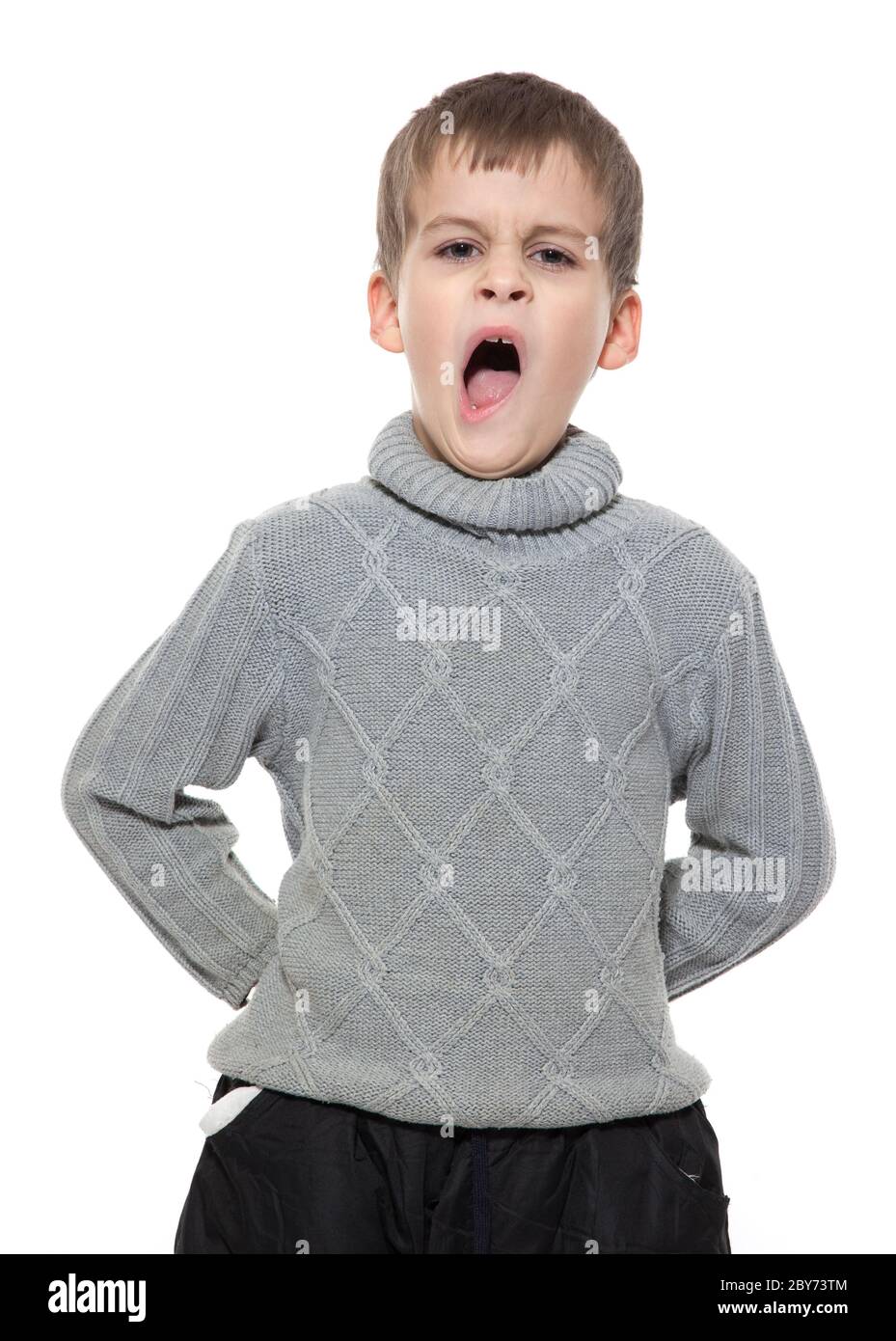 Cute boy yawning Stock Photo - Alamy