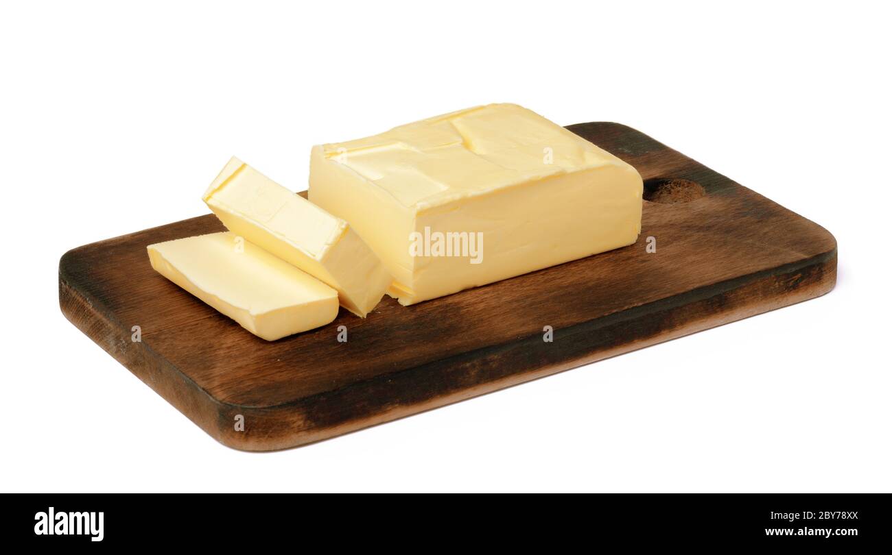 Butter on wooden board isolated on white background Stock Photo - Alamy