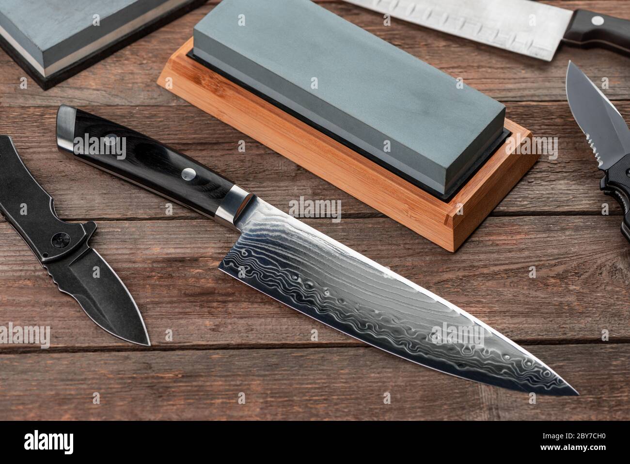 Top view on Japanese chef's and Santoku knives, pocket knives and ...